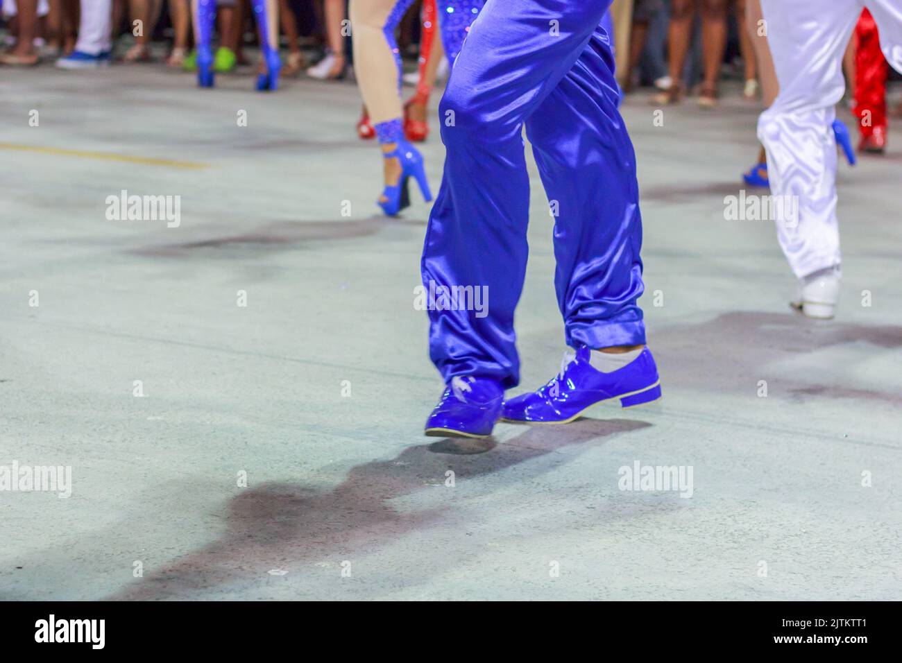 samba player with blue pants during rehearsal of samba school in Rio de ...