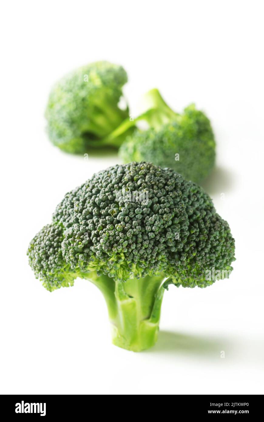 Broccoli florets on white background Stock Photo - Alamy