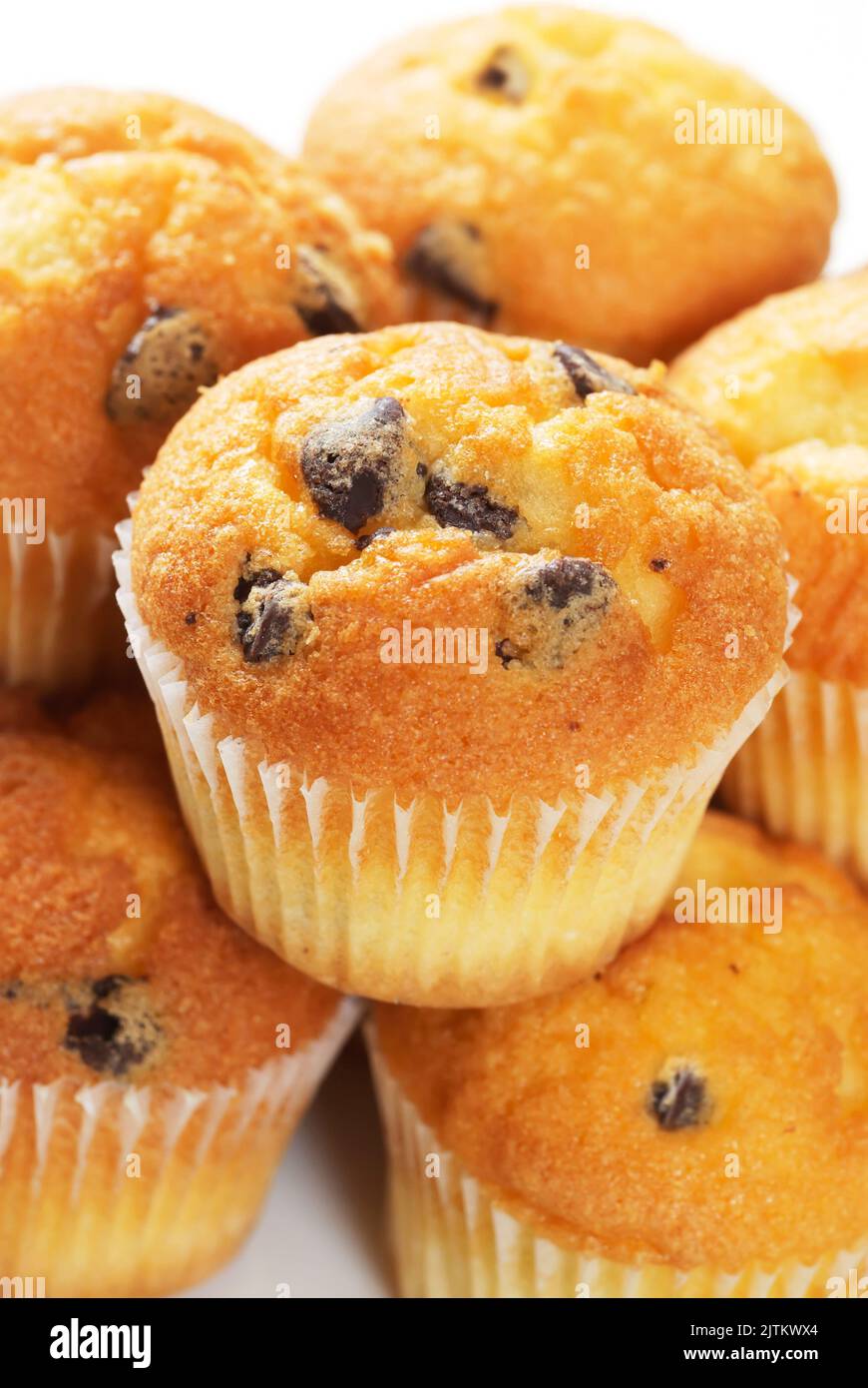 A pile of mini chocolate chip muffins, close-up Stock Photo - Alamy