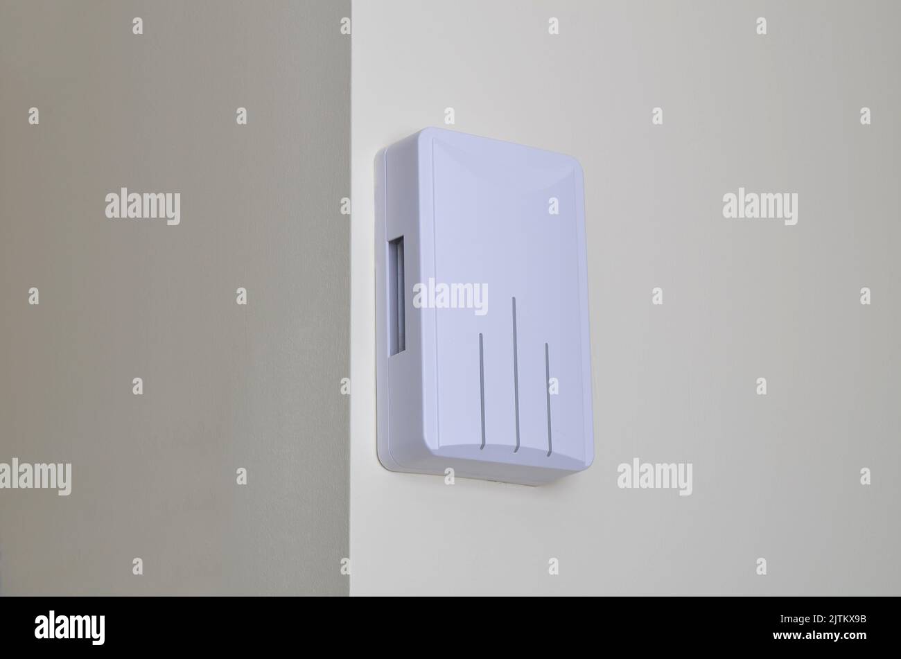 Door bell ringer unit mounted on wall Stock Photo - Alamy