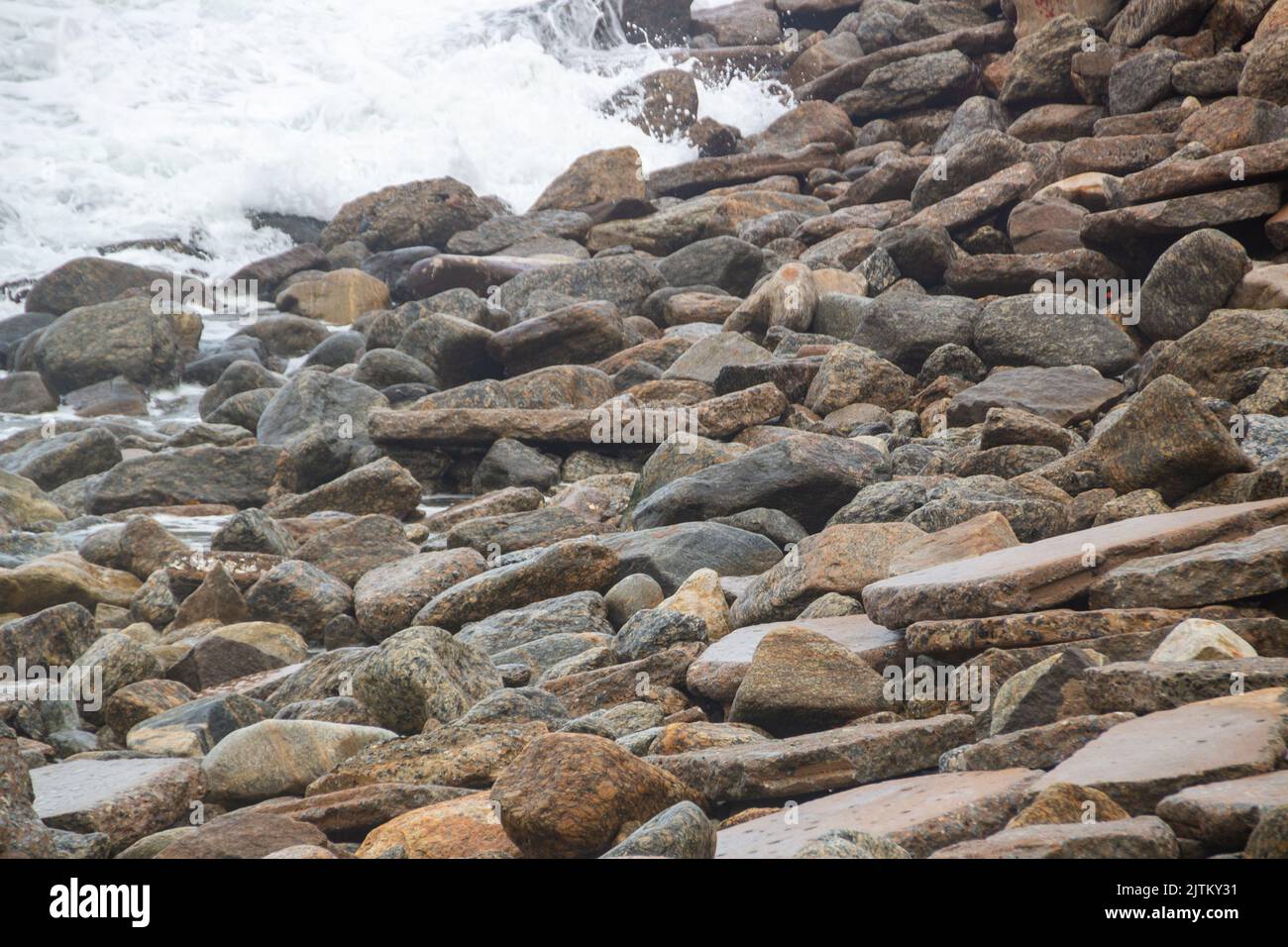 Stones and the sea on a Rio de Janeiro beach for background Stock Photo ...
