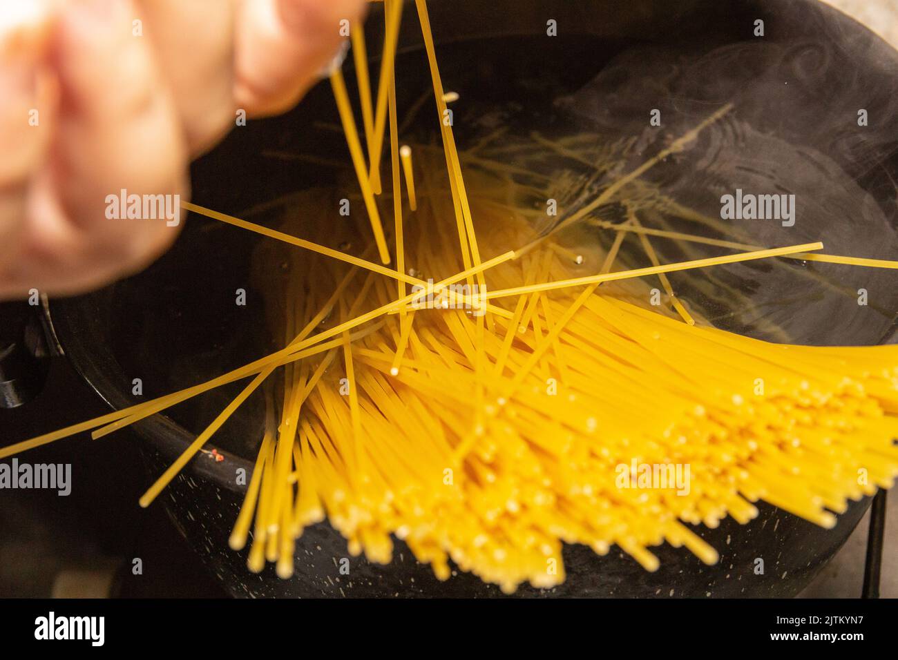 spaghetti pasta in a pan with water in Brazil Stock Photo - Alamy