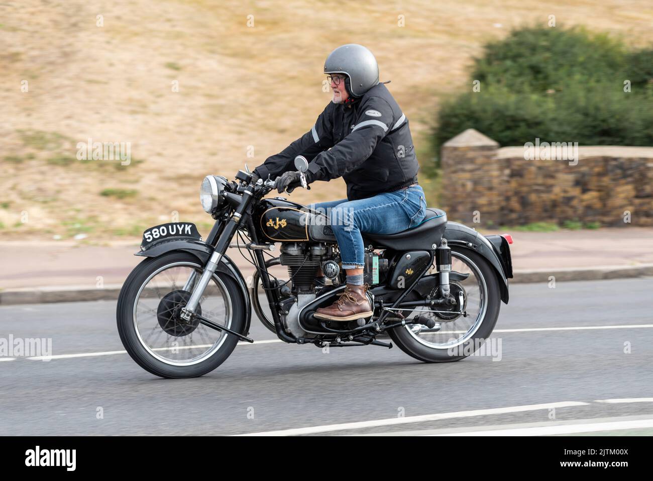 Vintage AJS motorcycle being ridden on Western Esplanade, Southend on ...