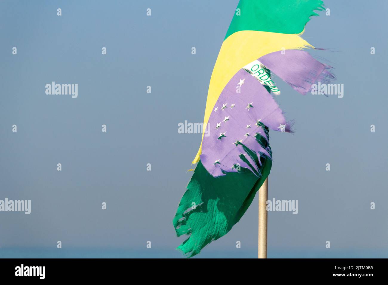 Faded and torn Brazil flag outdoors on Copacabana beach in Rio de ...