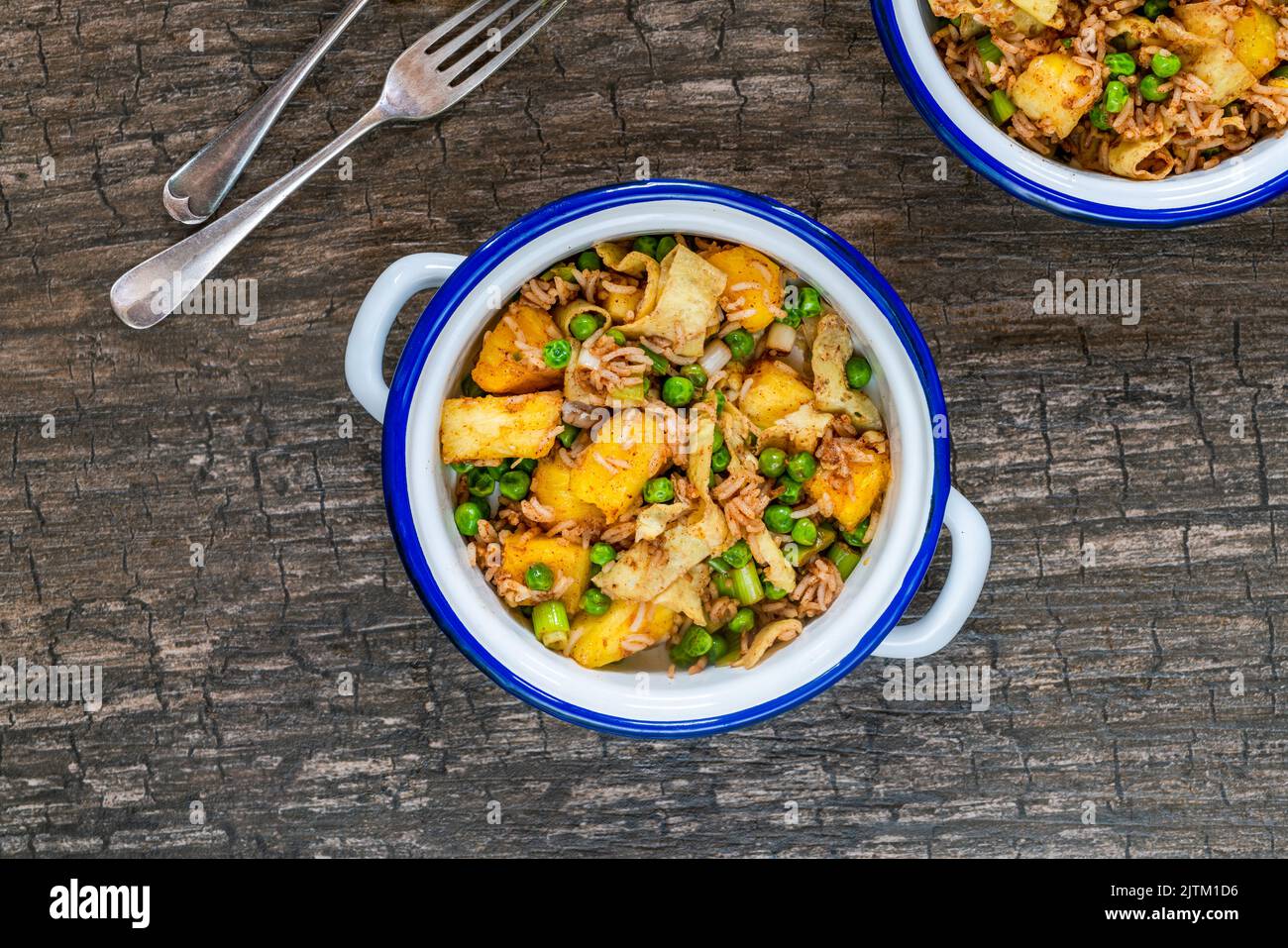 Spicy pineapple fried rice with green peas Stock Photo - Alamy