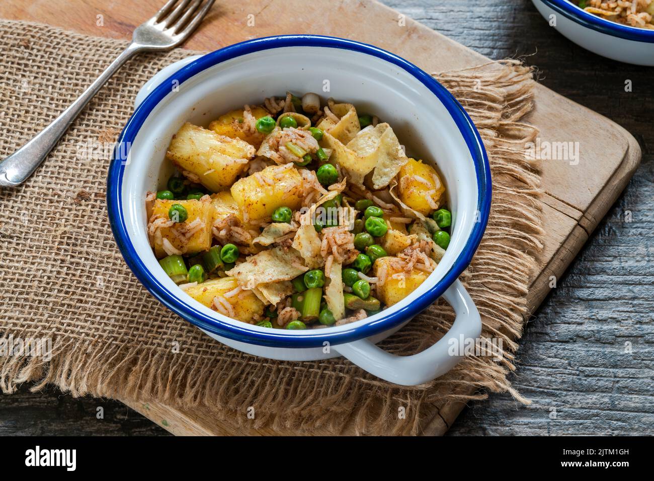 Spicy pineapple fried rice with green peas Stock Photo - Alamy