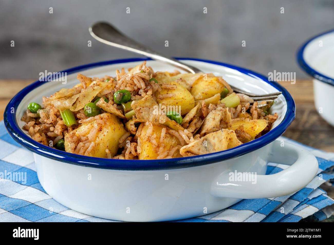 Spicy pineapple fried rice with green peas Stock Photo - Alamy