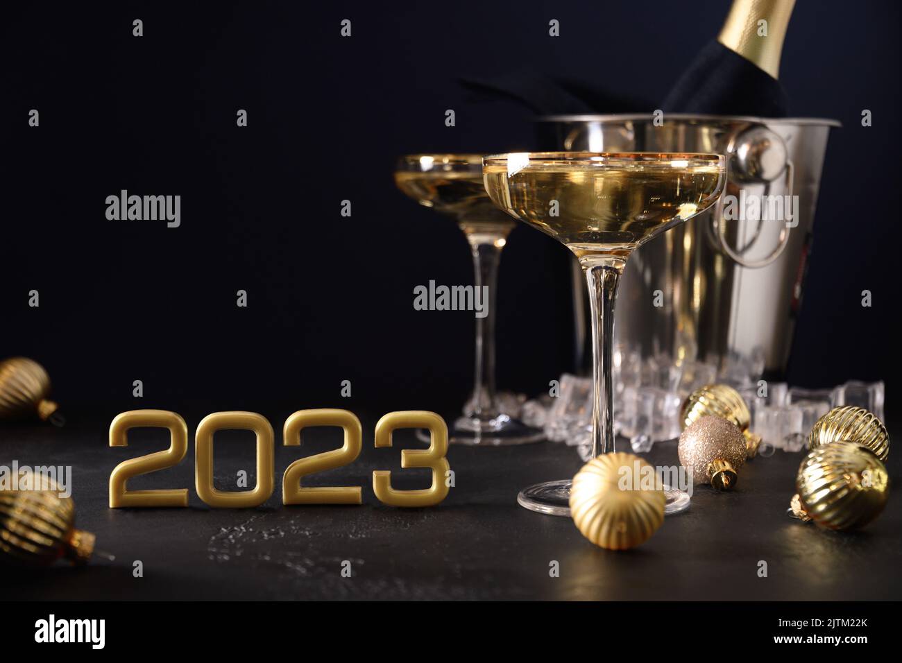 New Year champagne in wine glasses and bottle in bucket decorated ...
