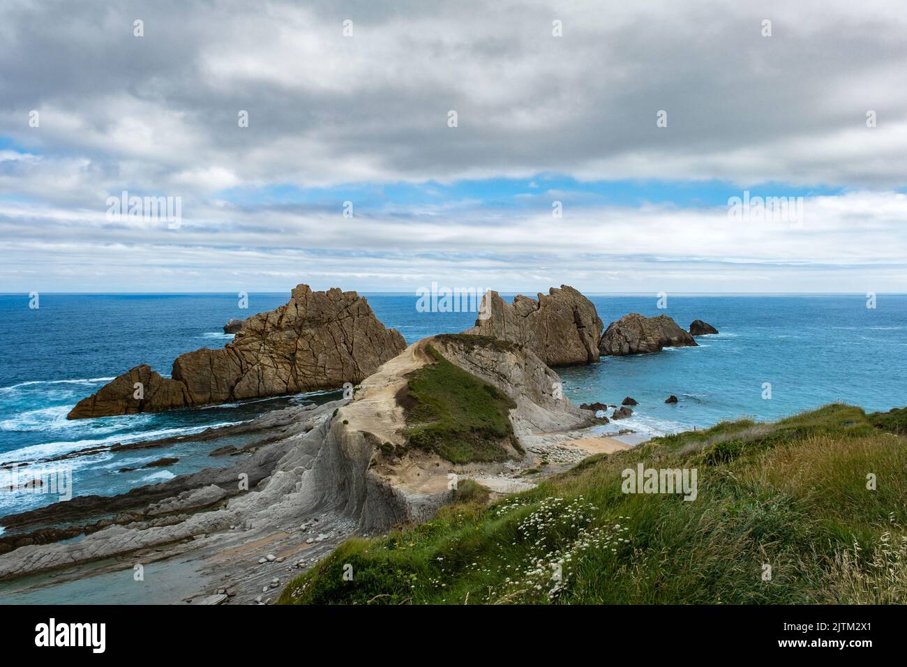 Cantabric coast landscape with vertical sea stacks and wave-cut ...