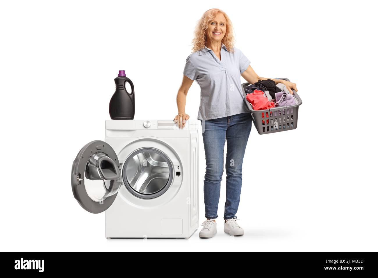 Housewife putting white clothes Cut Out Stock Images & Pictures - Alamy