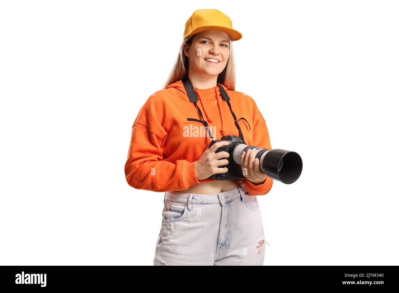 Young female photographer smiling at camera isolated on white ...