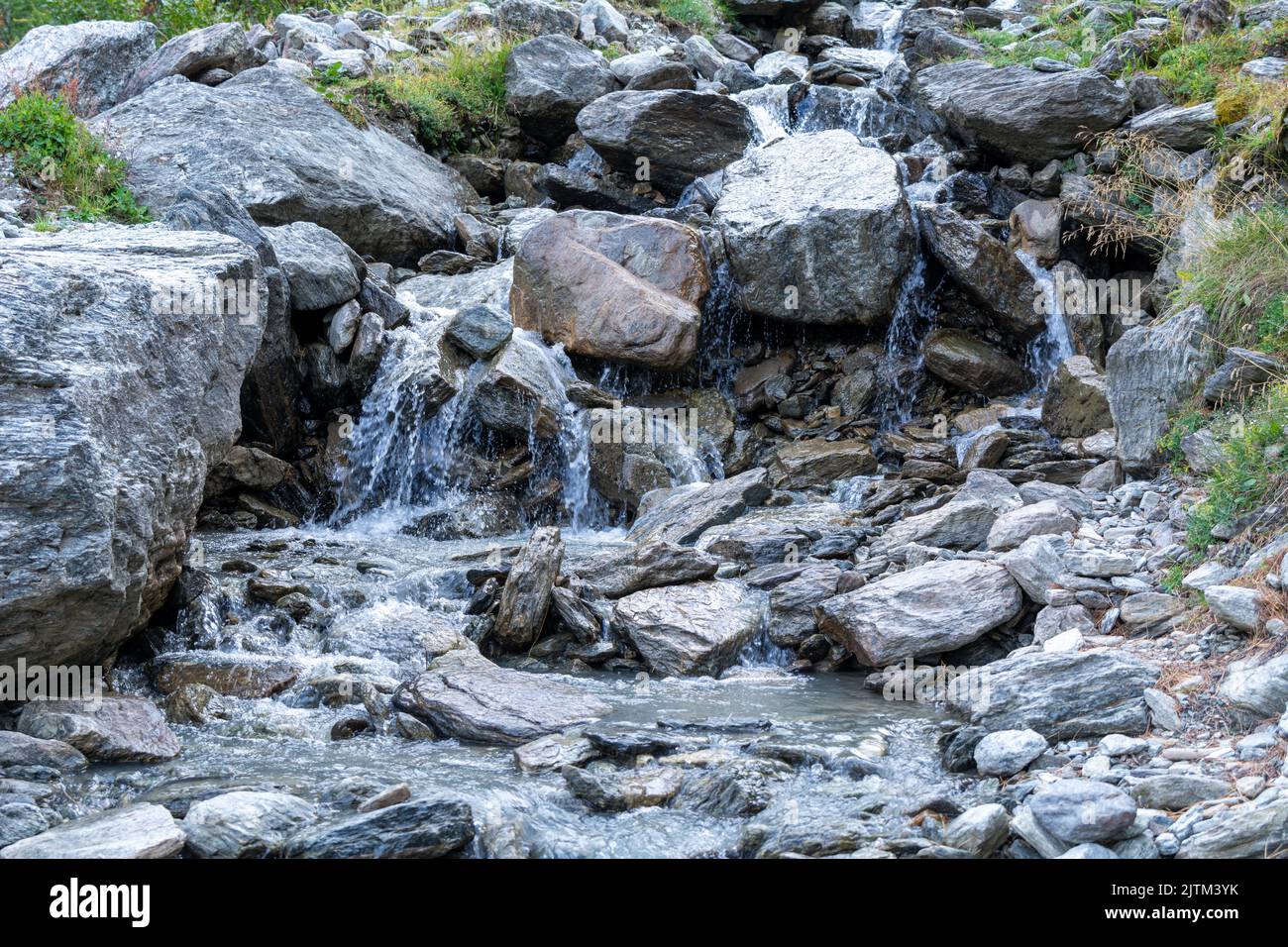 Cristal clear alpine stream with fresh water in the Austrian Alps Stock ...