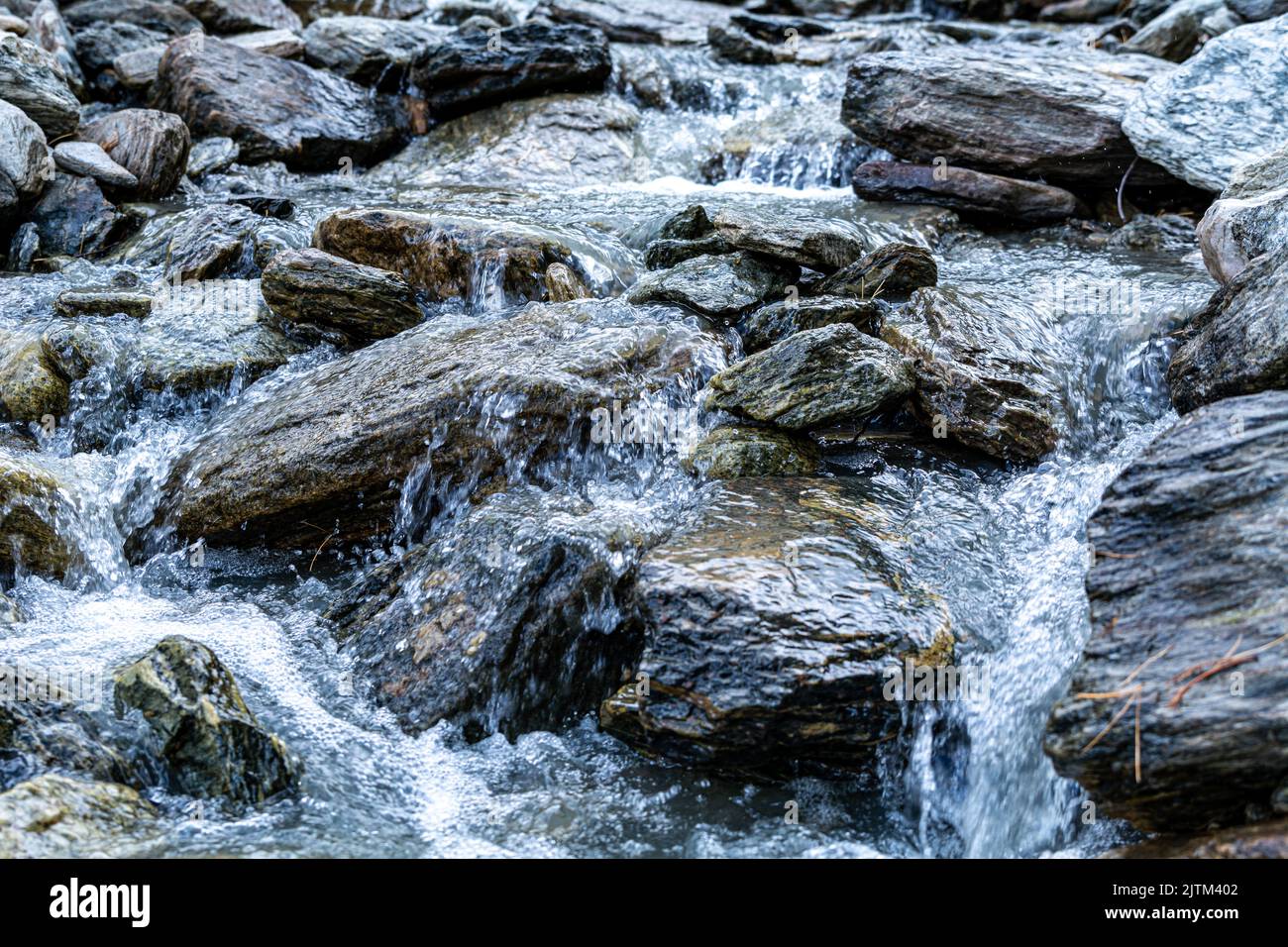Cristal clear alpine stream with fresh water in the Austrian Alps Stock ...