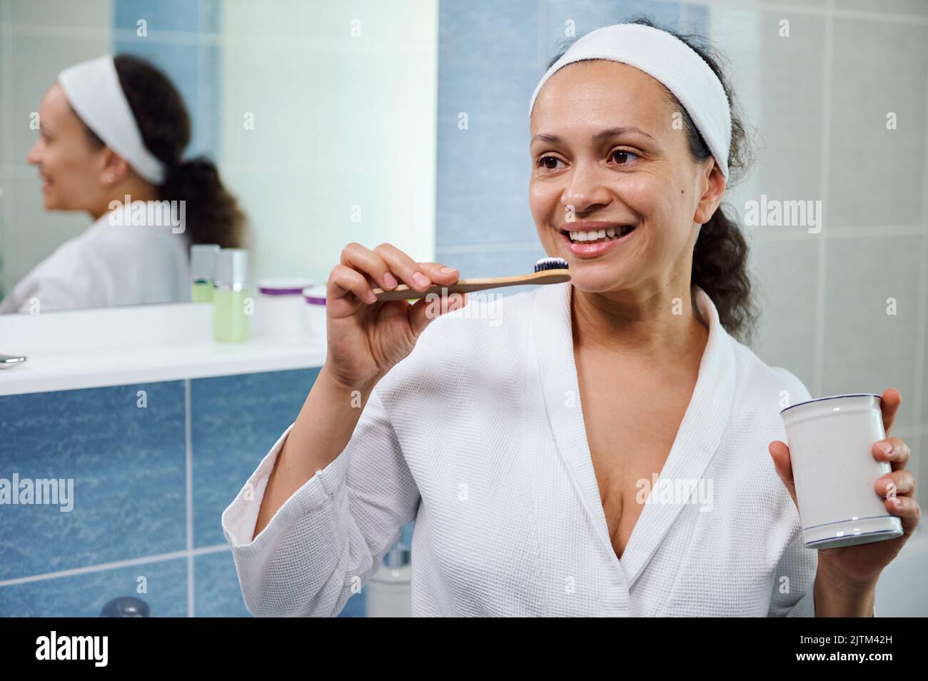 Delightful, natural beauty African American woman wearing white ...