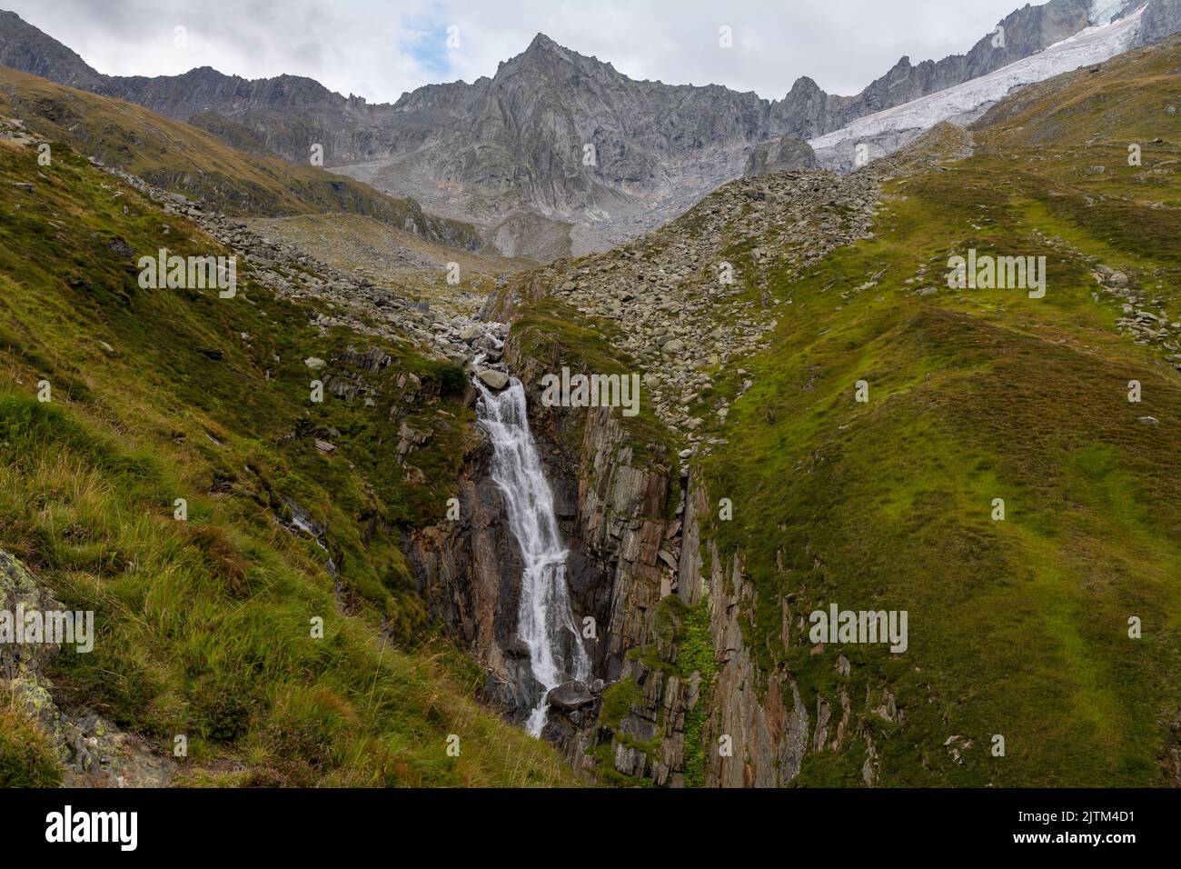 Alpine mountain waterfall in Summer Stock Photo - Alamy