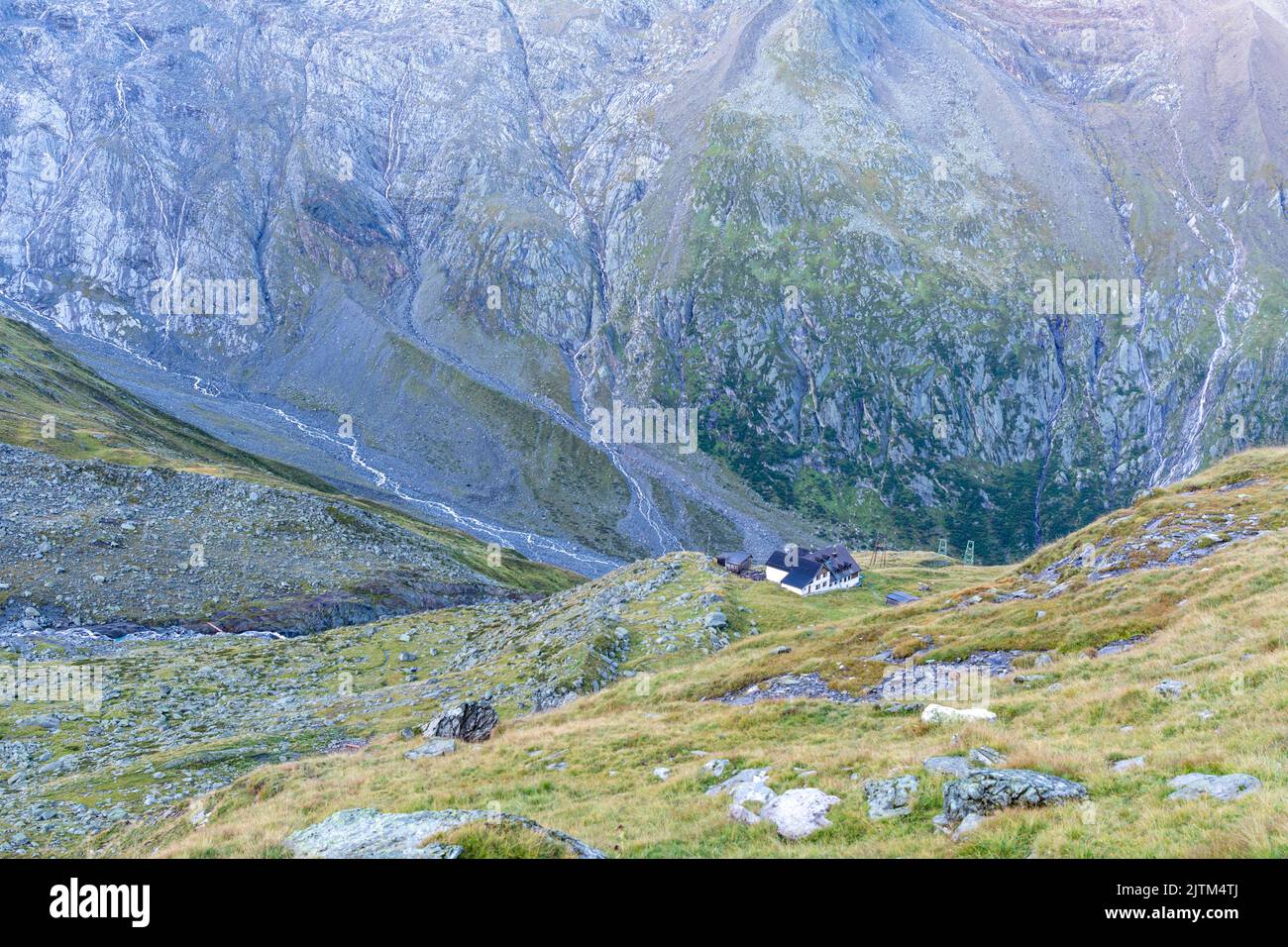 Impressive alpine view of high peaks in summer Stock Photo - Alamy