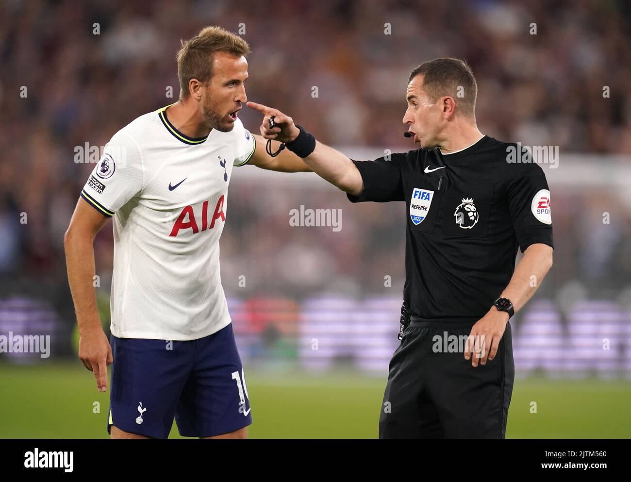 Tottenham Hotspur's Harry Kane (left) speaks with referee Peter Bankes ...