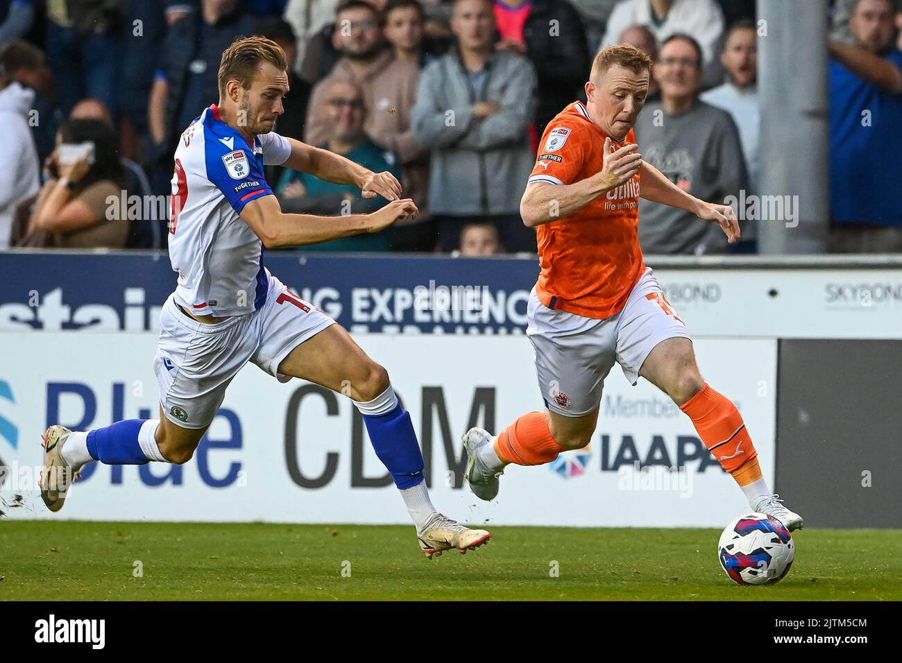 Shayne Lavery #19 of Blackpool makes a break with the ball Stock Photo ...