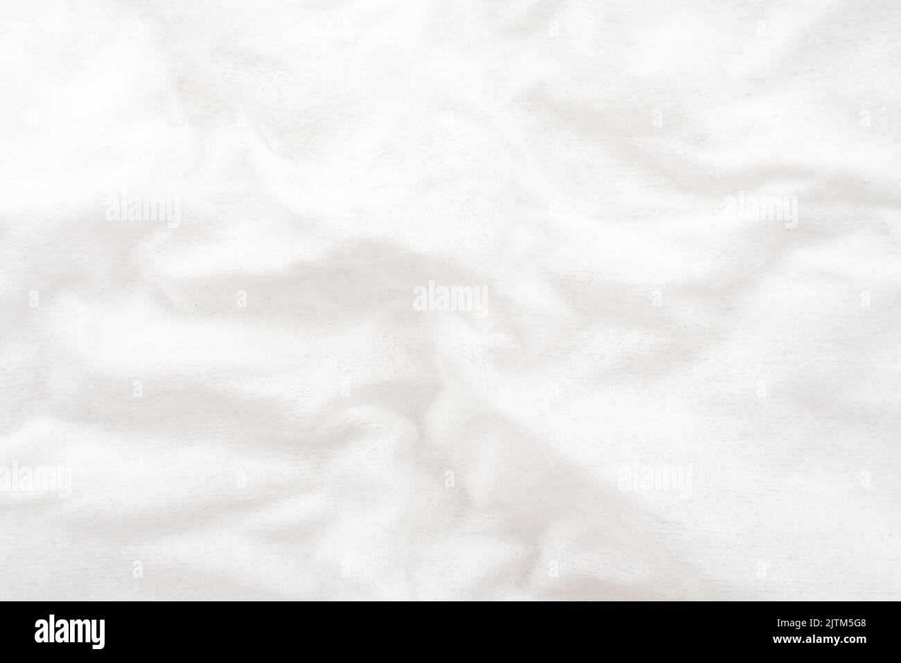 A twisted piece of white fabric. White material or texture with waves ...