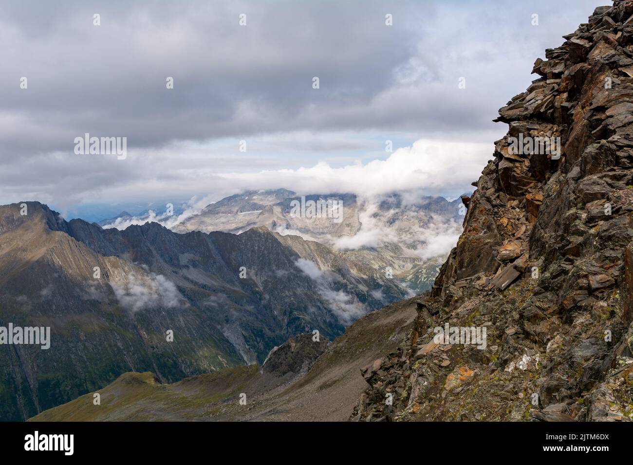 Impressive alpine view of high peaks in summer Stock Photo - Alamy