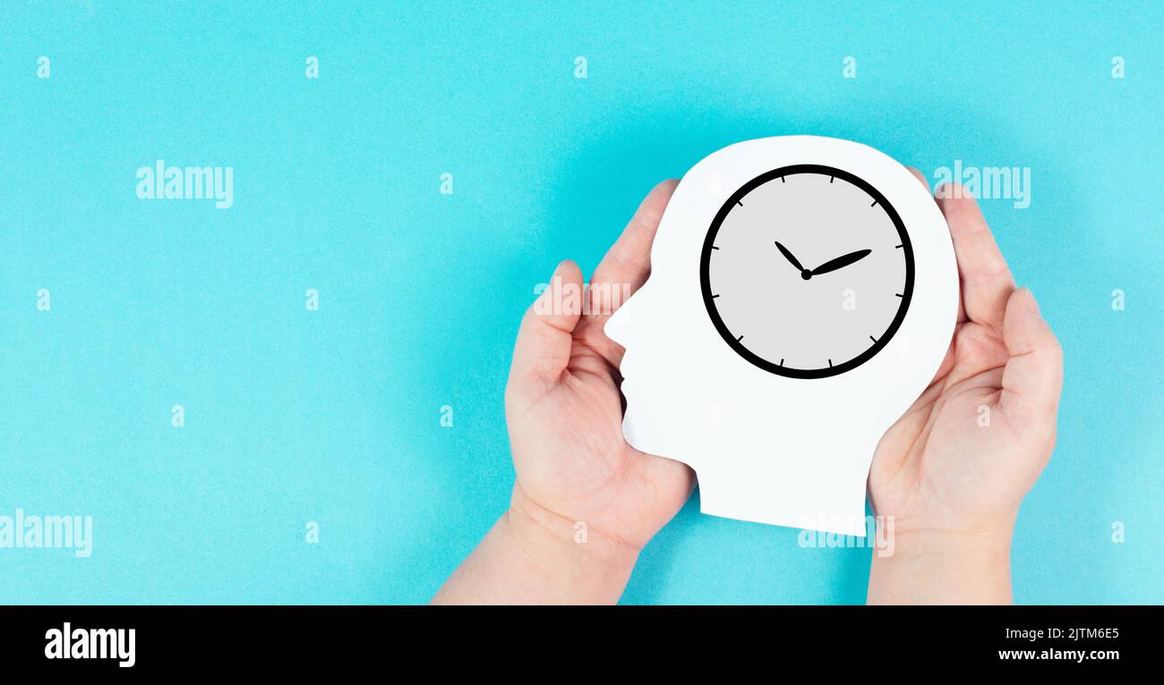 Silhouette of a head with a clock, time pressure and management in ...