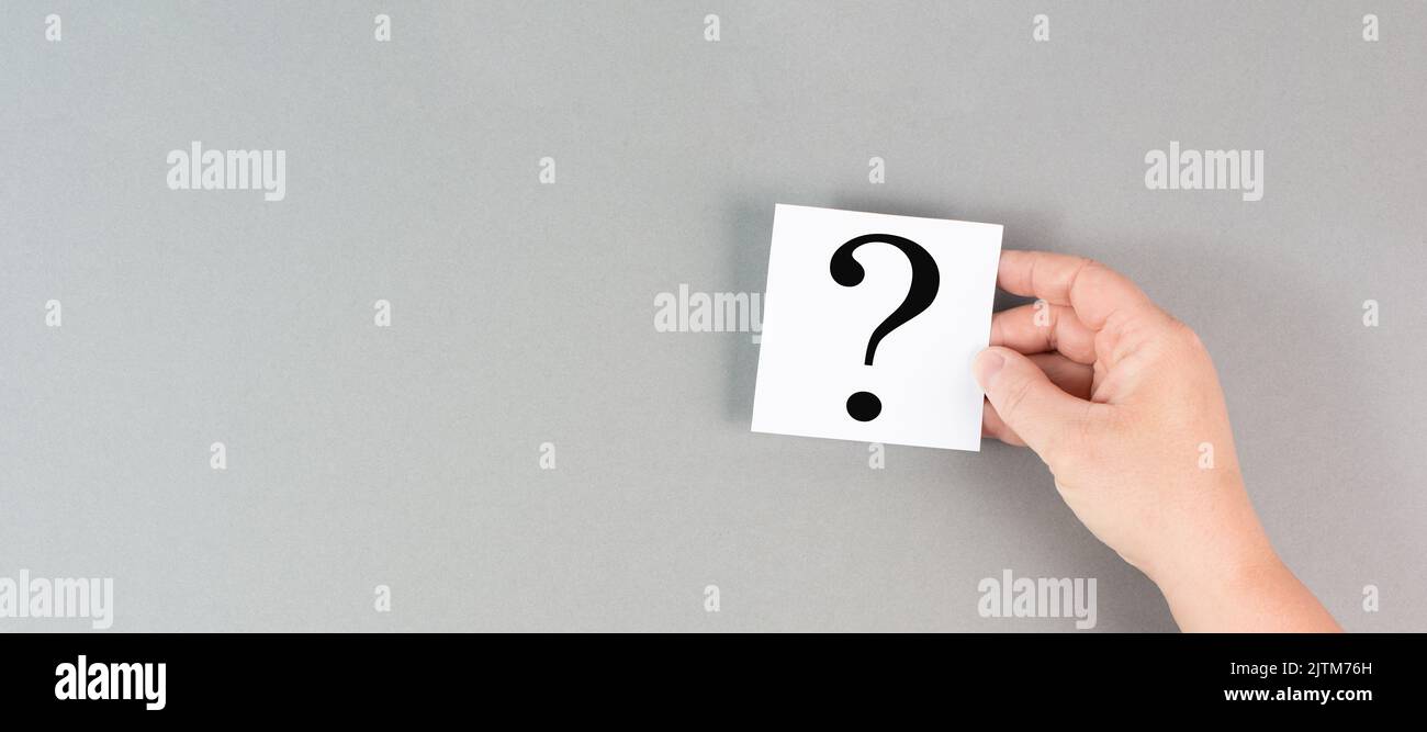 Question mark in the hand, looking for an answer, searching for ...