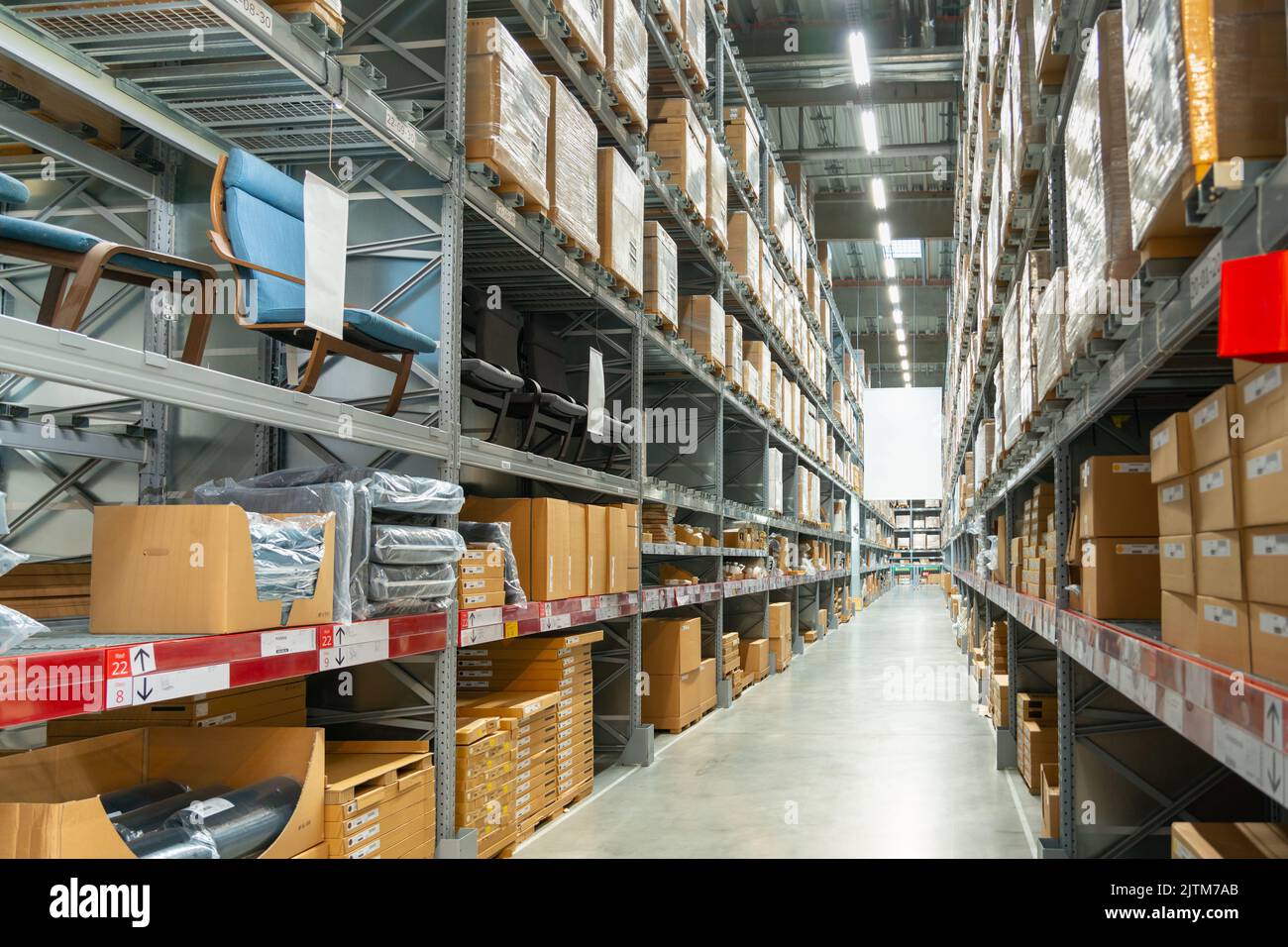 Warehouse interior aisle with goods and boxes Stock Photo - Alamy