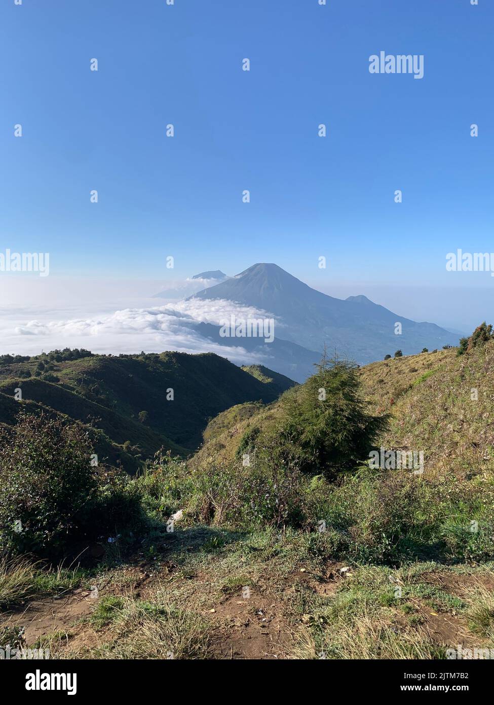 A vertical view of Mount Prau with Mount Sindoro and Mount Sumbing in ...
