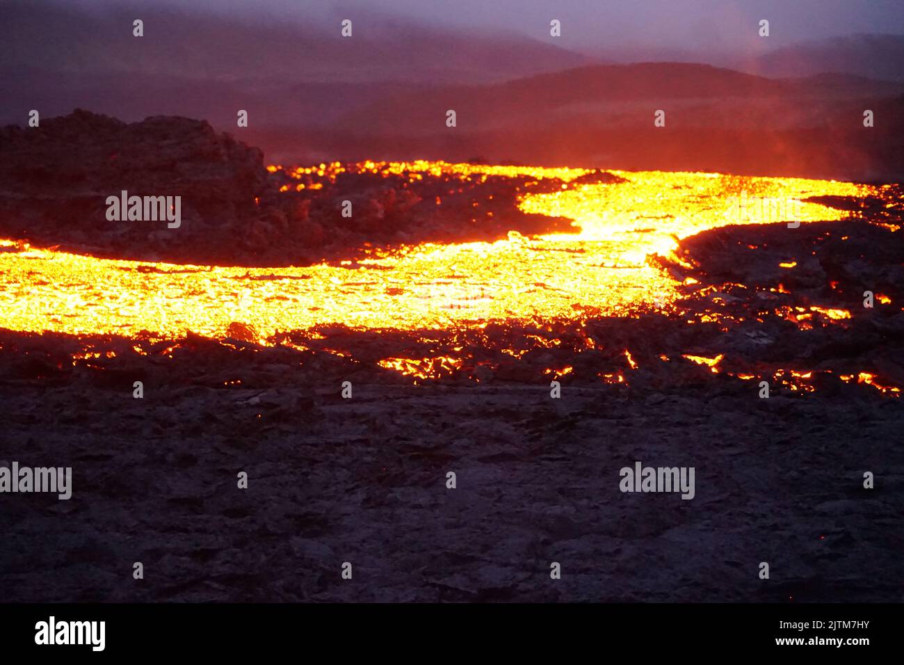 An aerial view of the Fagradalsfiall volcano eruption and hot lava on ...