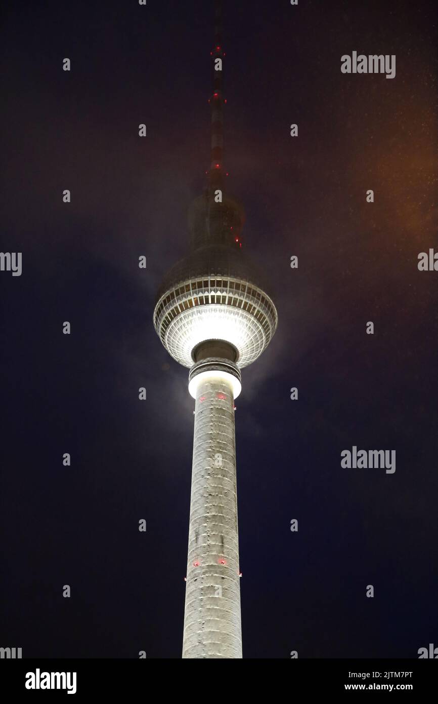 Berlin TV Tower from below at night Stock Photo - Alamy
