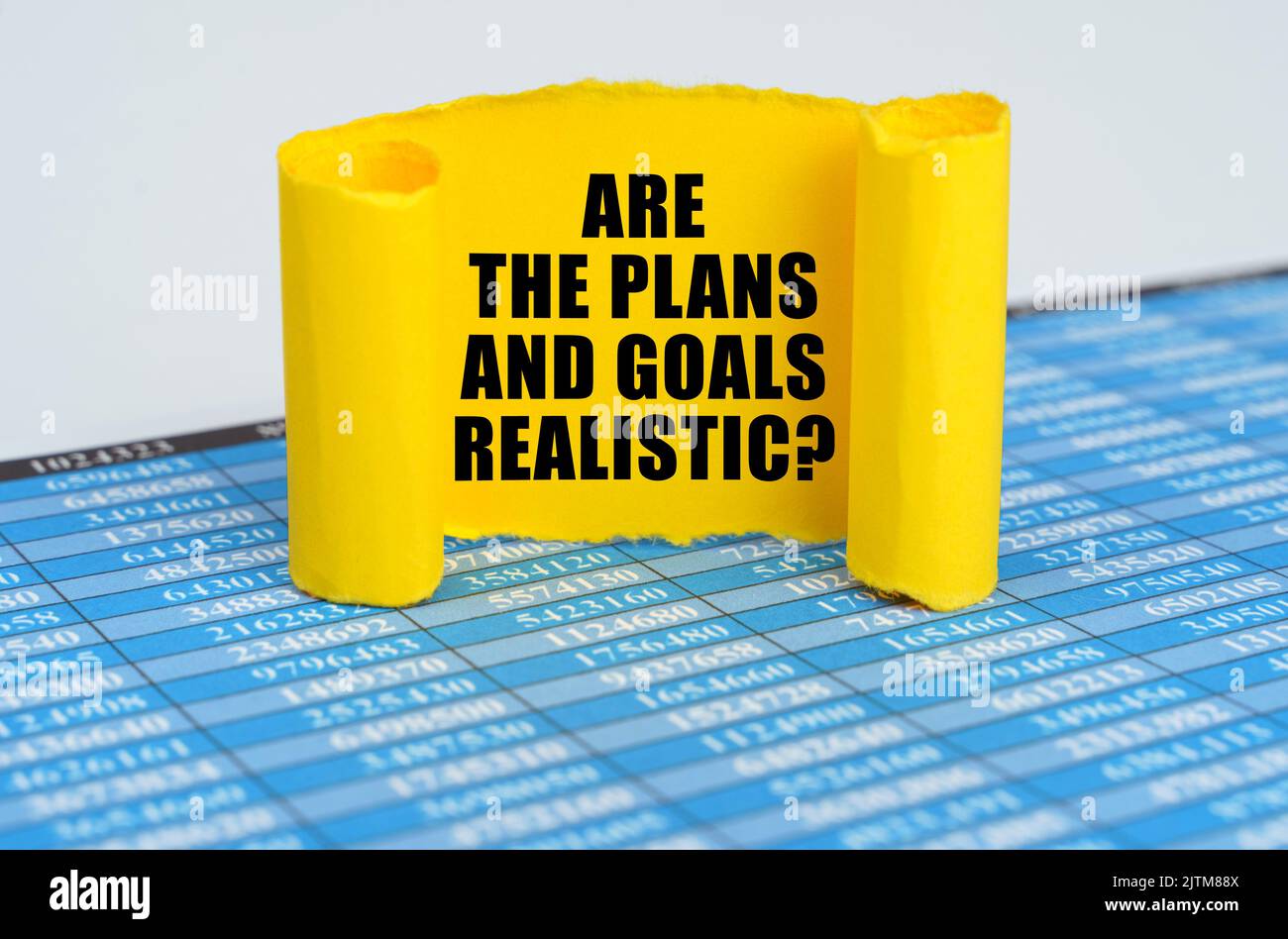 Business concept. On reporting documents, a yellow paper plate with the ...