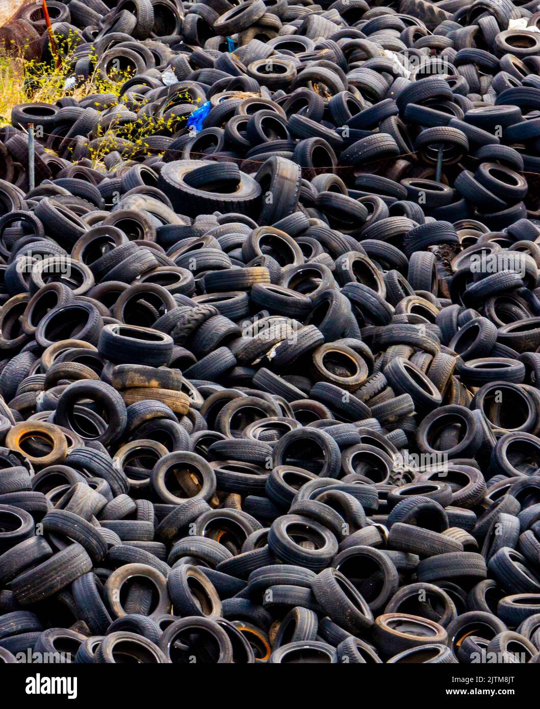 Backdrop of landfill with old used tires Stock Photo - Alamy