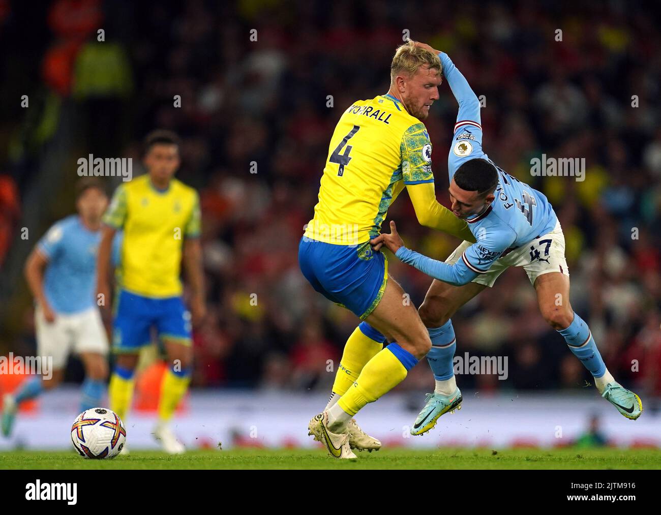 Nottingham Forest's Joe Worrall collides with Manchester City's Phil ...