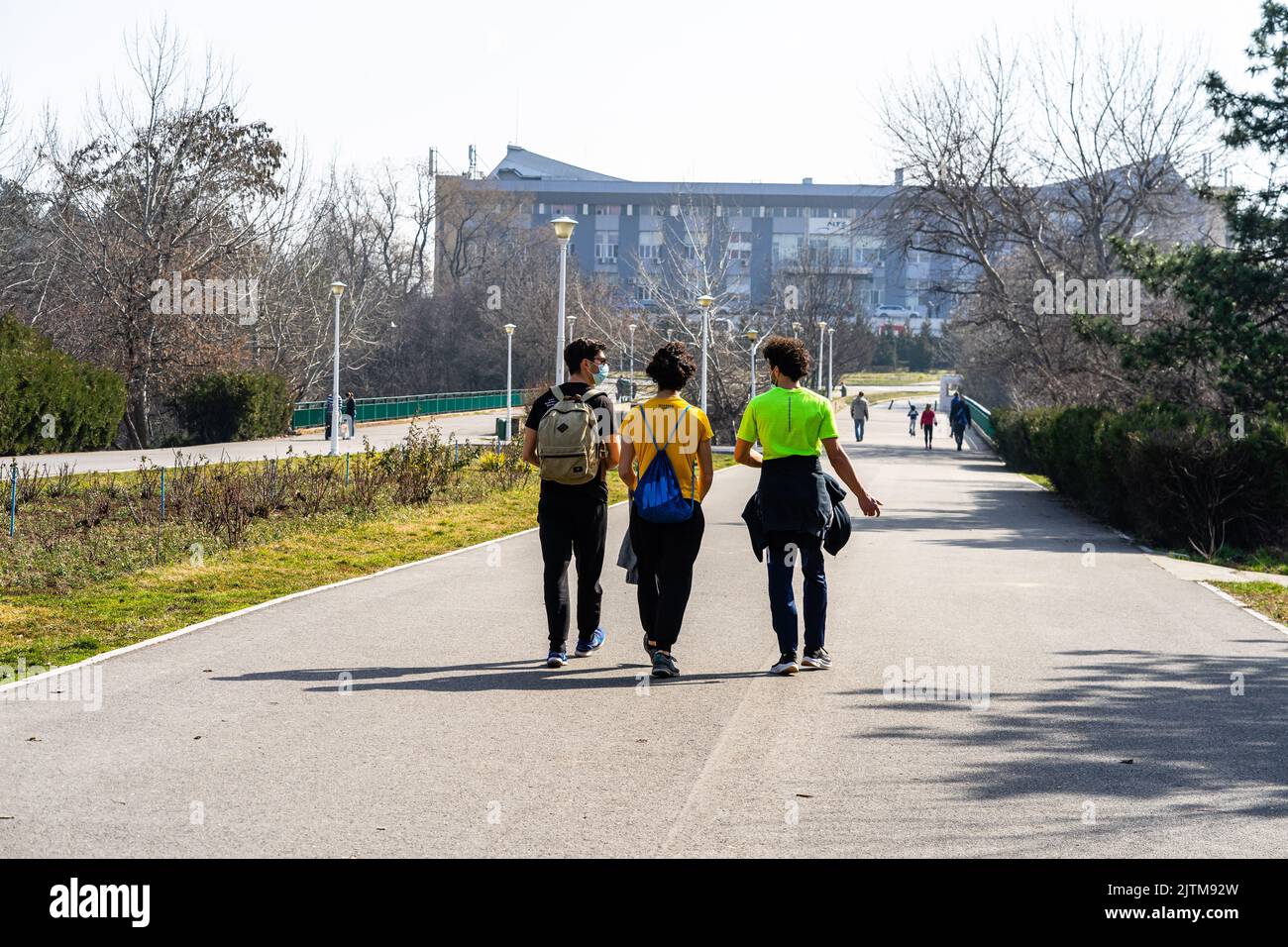People and tourists wander the streets of the Bucharest Old Town ...