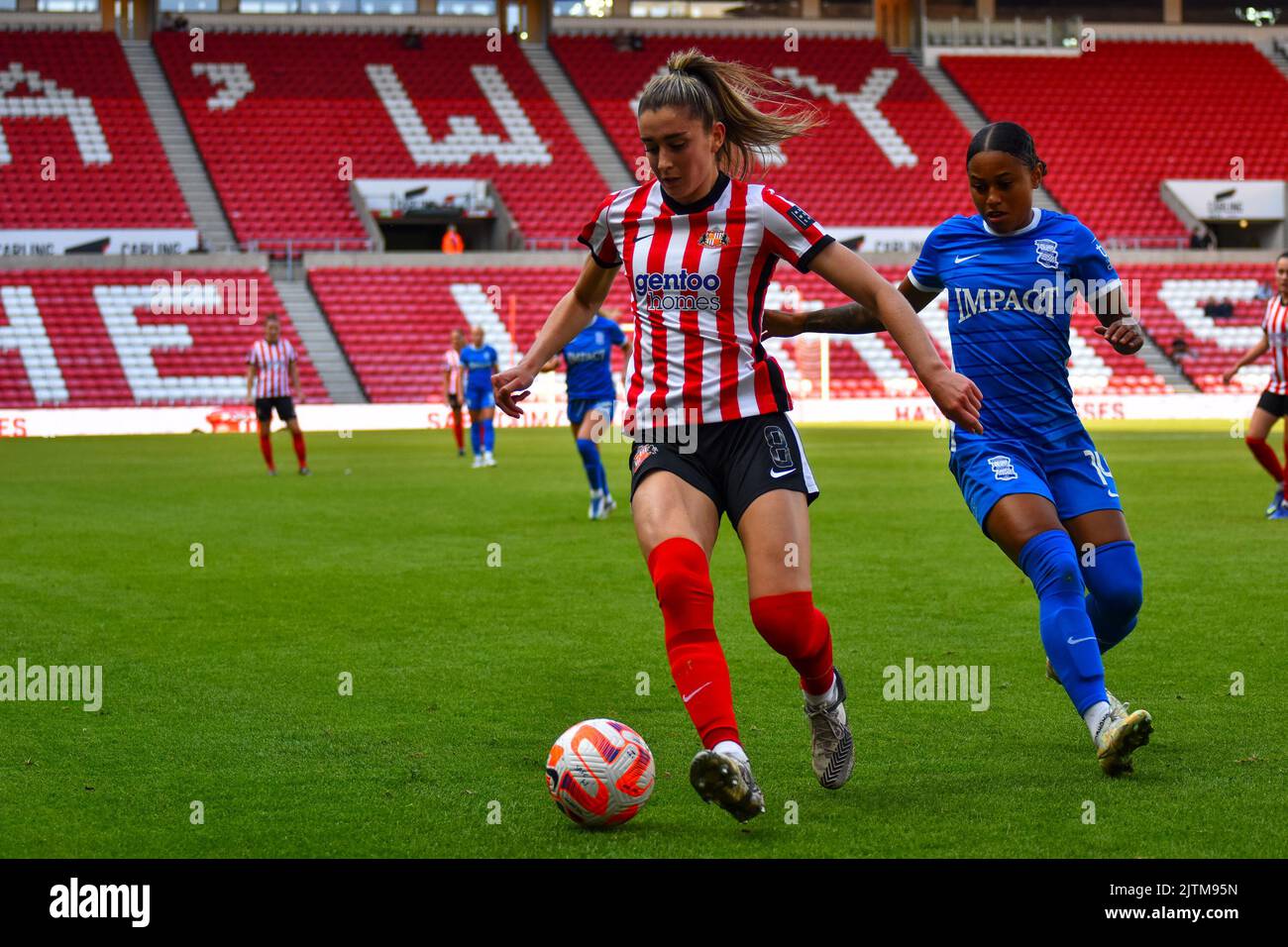 Sunderland Women forward Emily Scarr shields the ball from Siobhan ...