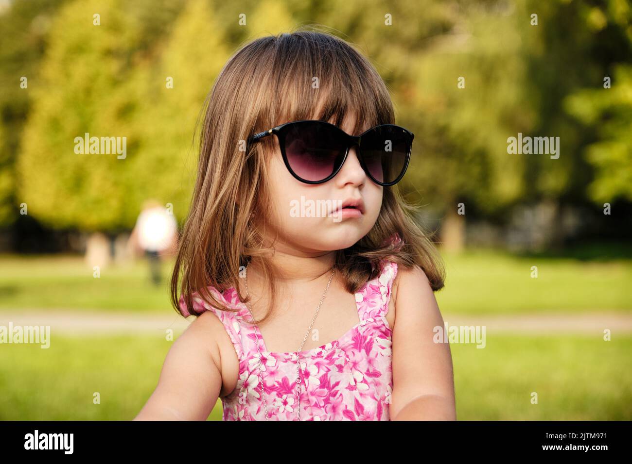 Little girl wearing mom's sunglasses. Portrait of a sweet baby girl who ...