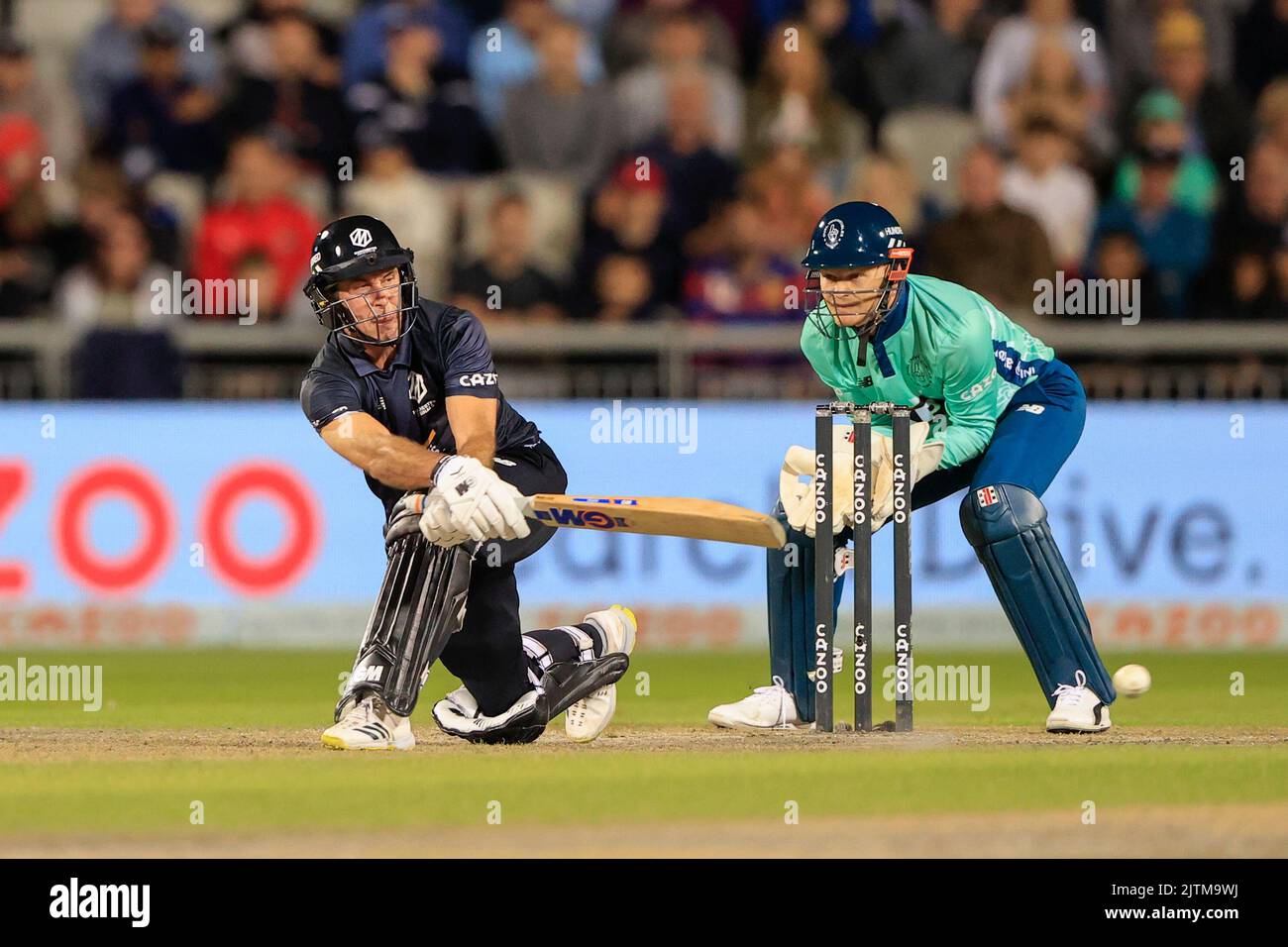 Batting action hi-res stock photography and images - Alamy