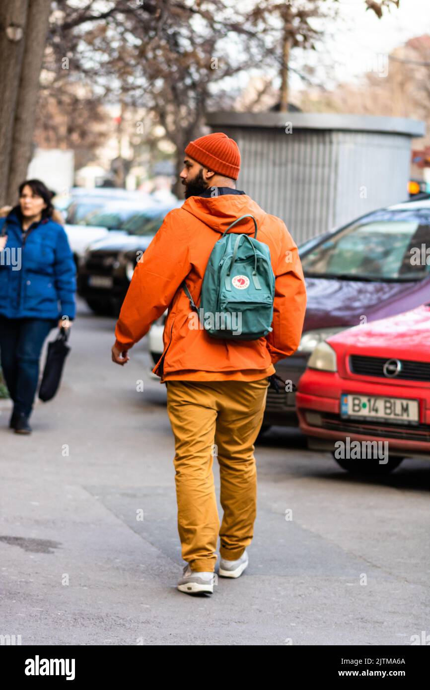 People and tourists wander the streets of the Bucharest Old Town ...
