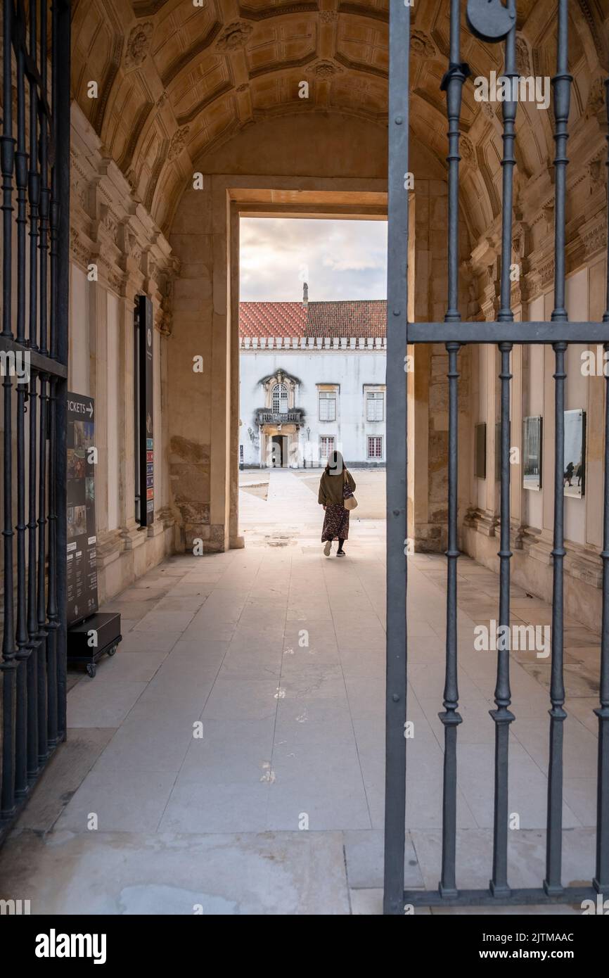 Campus of Coimbra university. Student viewed from behind on the end of ...