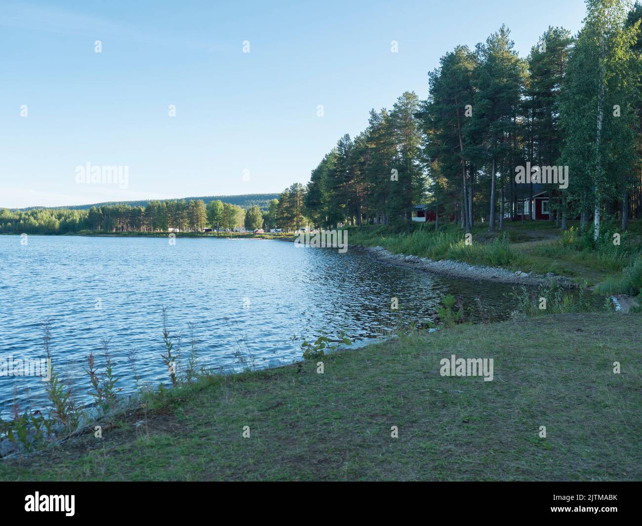 summer view of Lille Lulealven river at Arctic Camp Jokkmokk ,blue sky ...