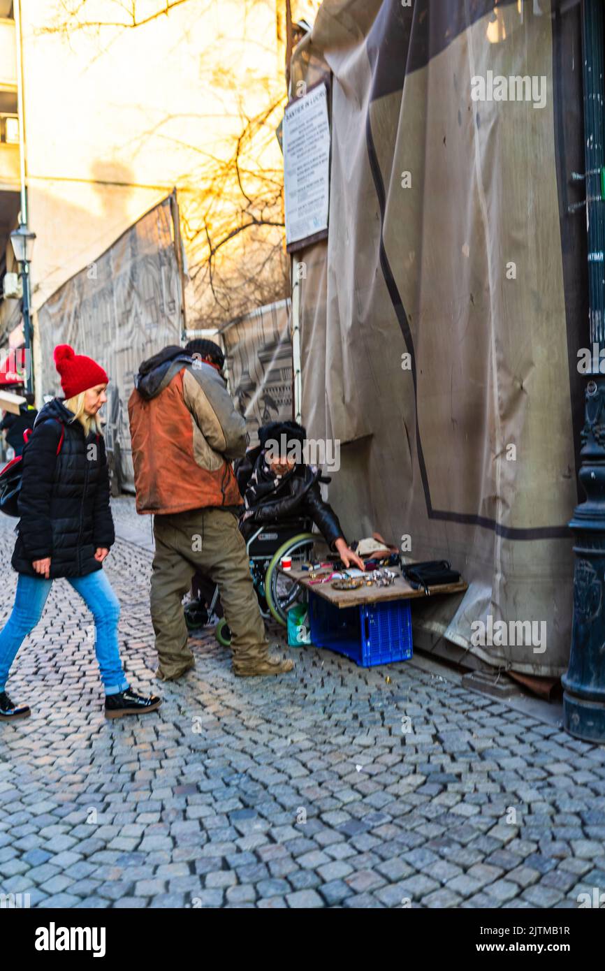 People and tourists wander the streets of the Bucharest Old Town ...