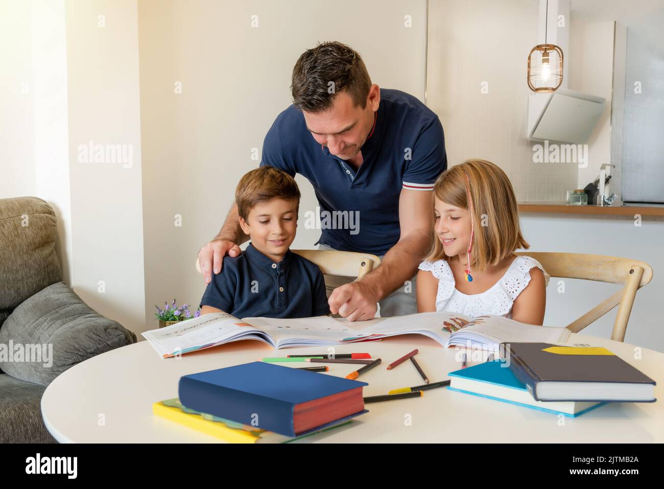 Smiling children drawing and studying at home with a private tutor. Personalized tutoring for ...