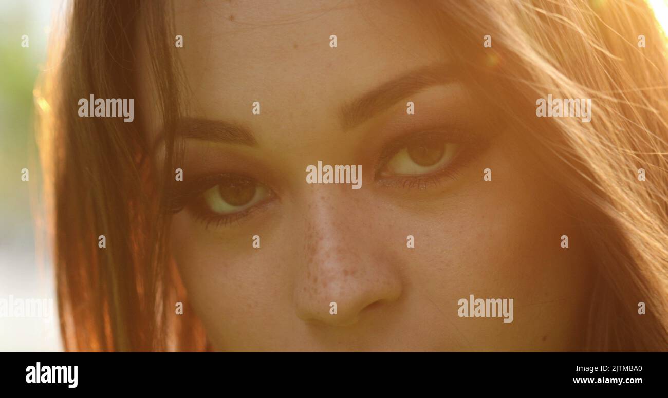 Closeup of pretty girl eyes looking to camera. Young woman in hero 20s ...
