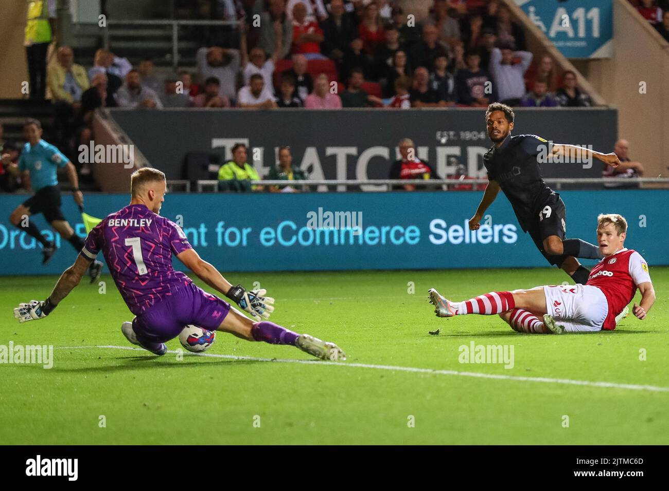 Duane Holmes #19 of Huddersfield Town has a shot at goal which Daniel ...