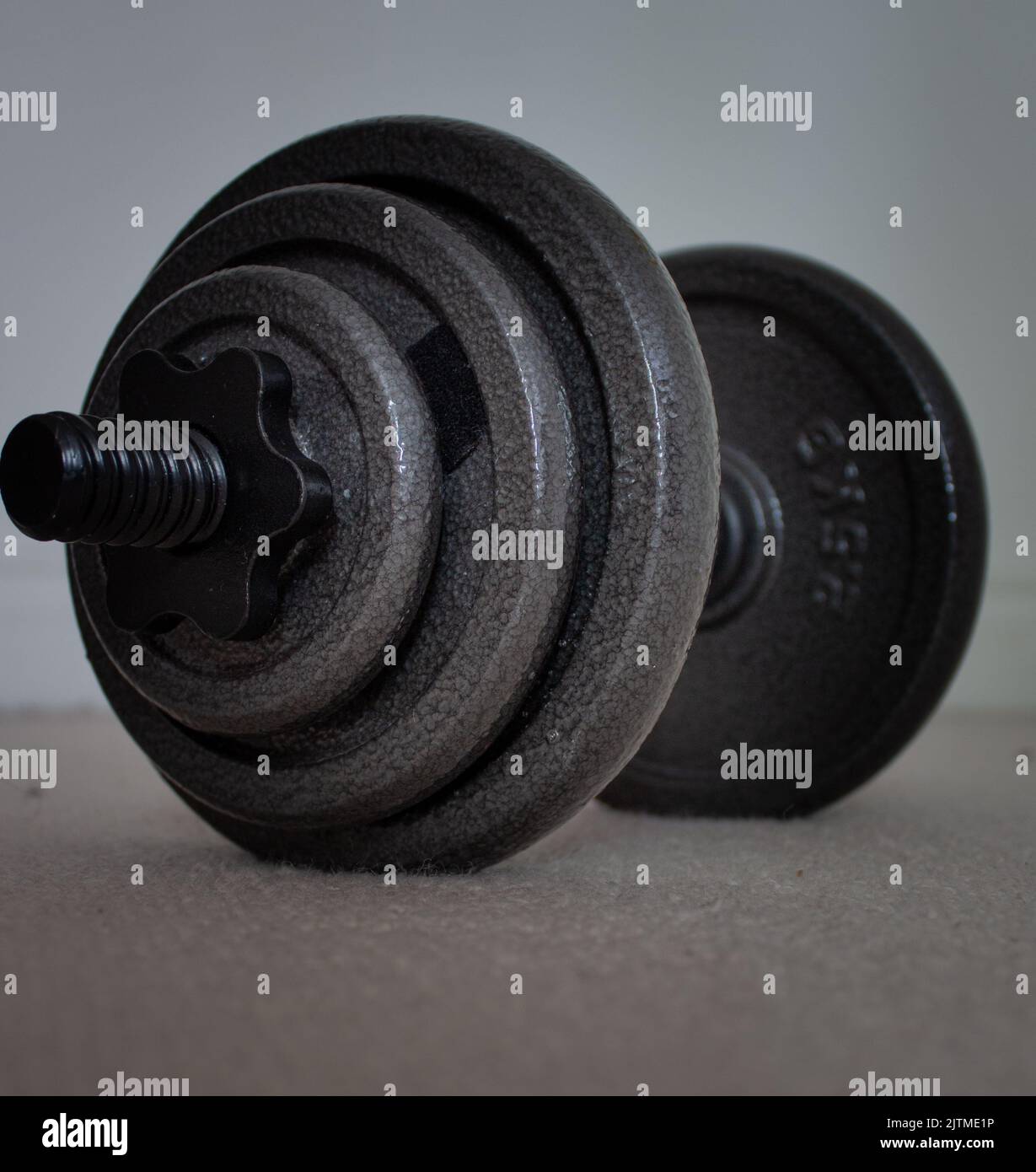 A closeup of a dumbbell Stock Photo - Alamy