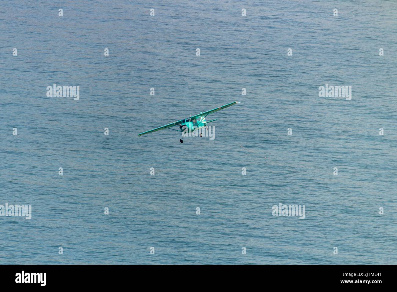 small plane flying over copacabana beach in Rio de Janeiro Brazil Stock ...