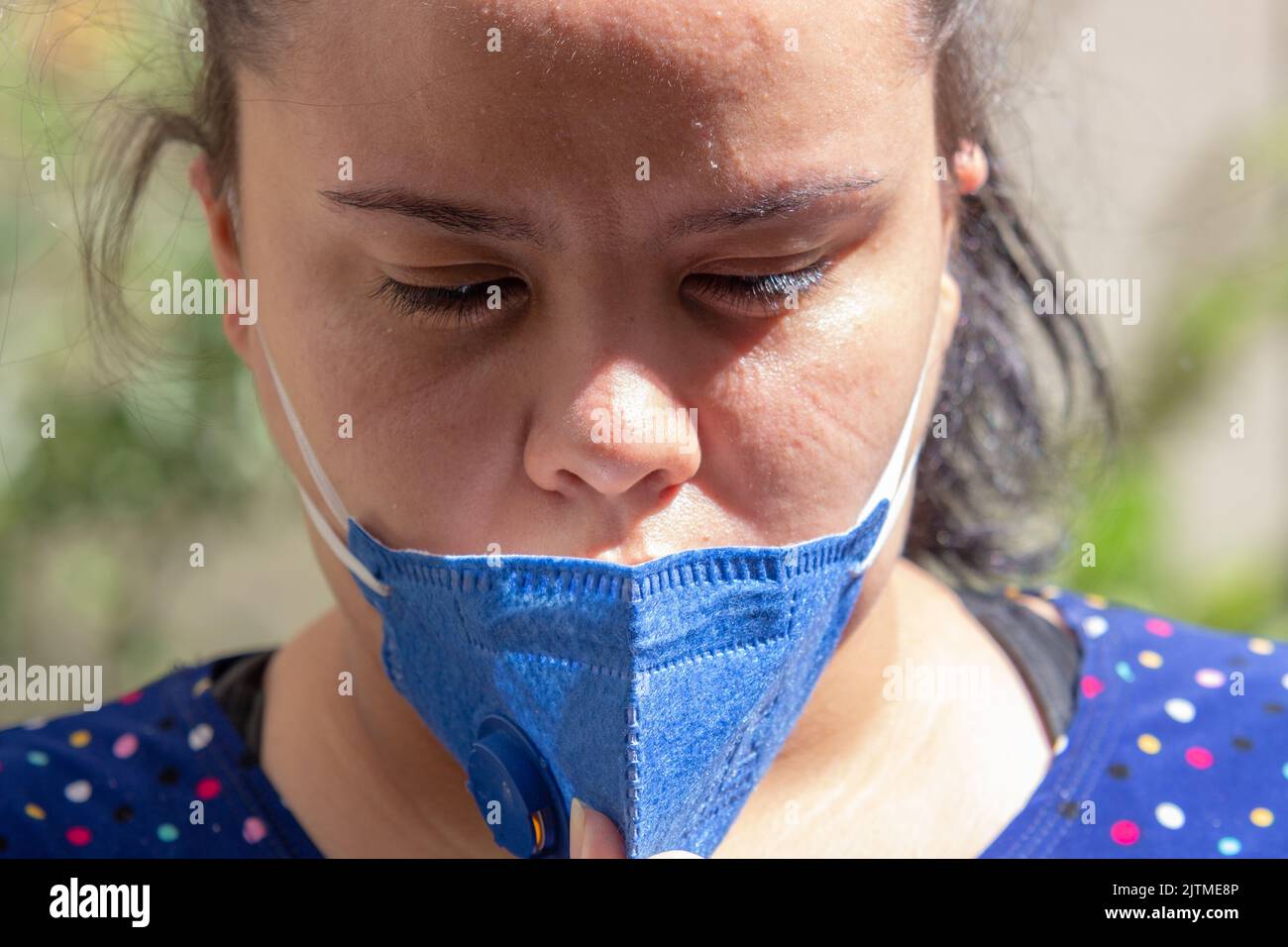 Woman with marks on her face and mask pff2 n95, protection against ...