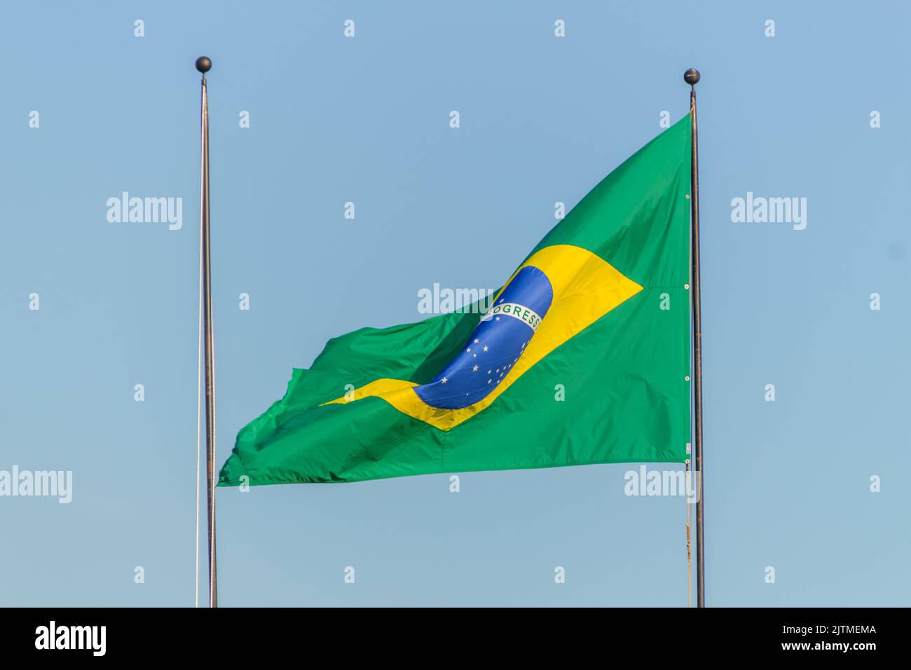 Brazilian flag flying with blue sky background in Rio de Janeiro Stock ...