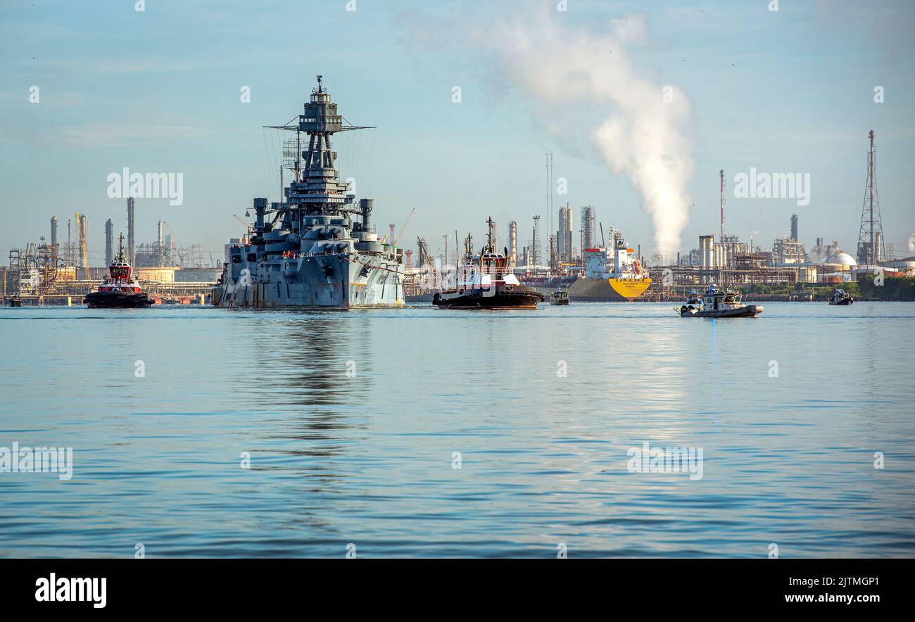 Law enforcement boat crews protect the battleship USS Texas as pilot ...