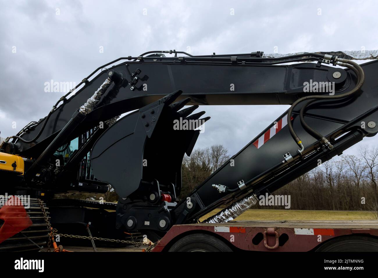 On the highway, heavy construction equipment is being carried on a ...